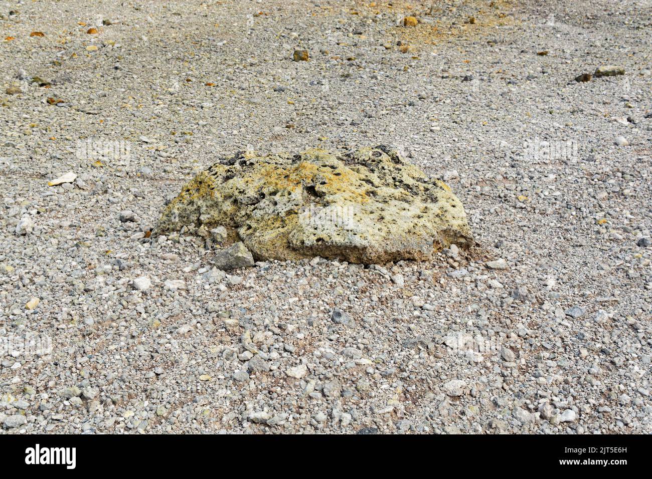 volcanic bomb among the tephra on the slope of the volcano close-up ...