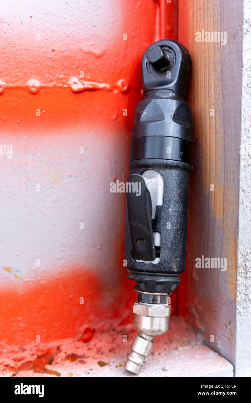 Close-up. air ratchet wrench. angular pneumatic wrench on a gray ...