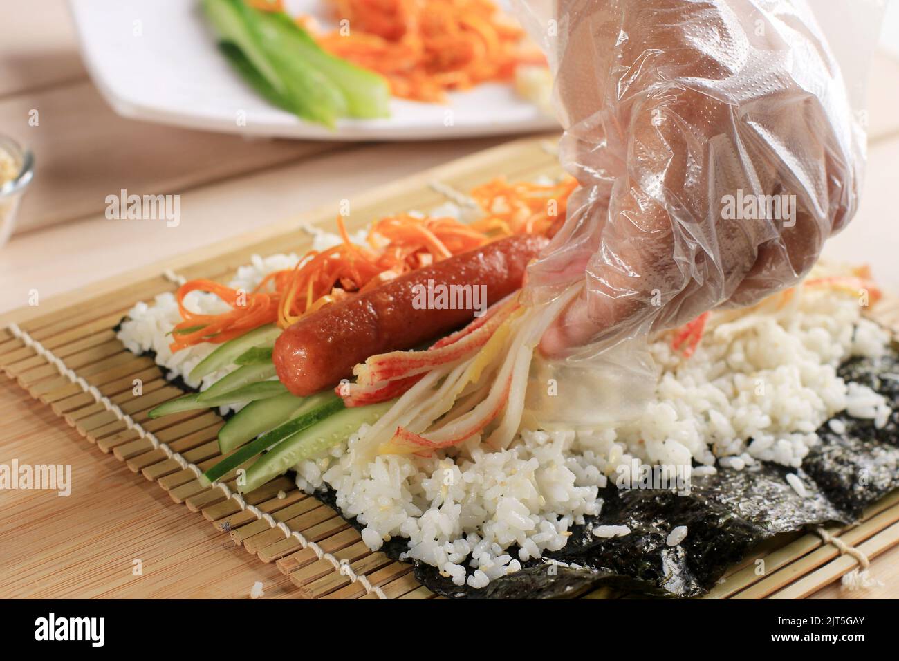 Close Up Korean Female Making Gimbap, Korean Roll Rice with Sausace ...