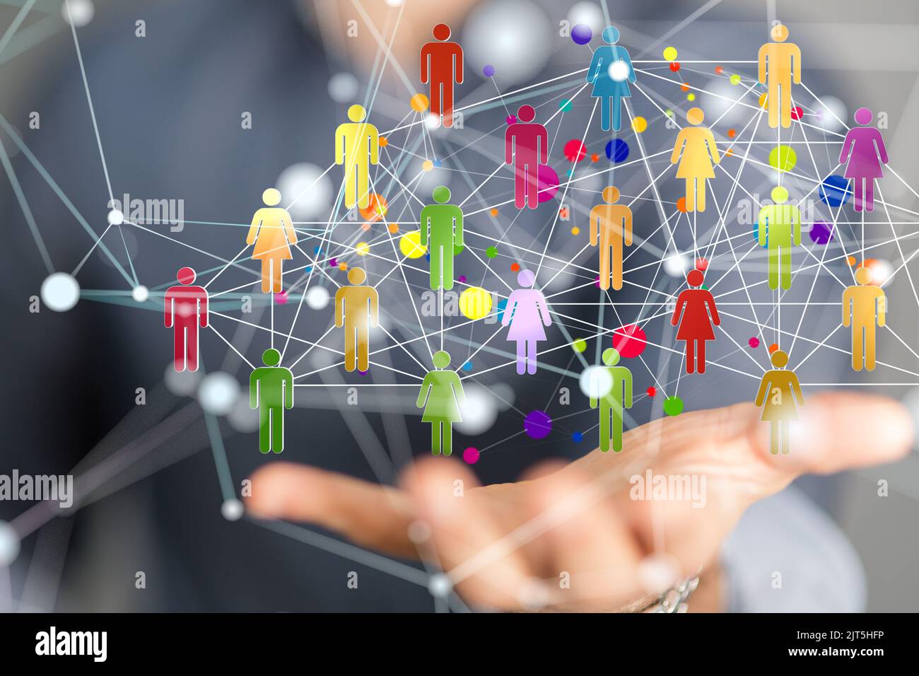 The palm of the hand holding a network with colorful male and female ...