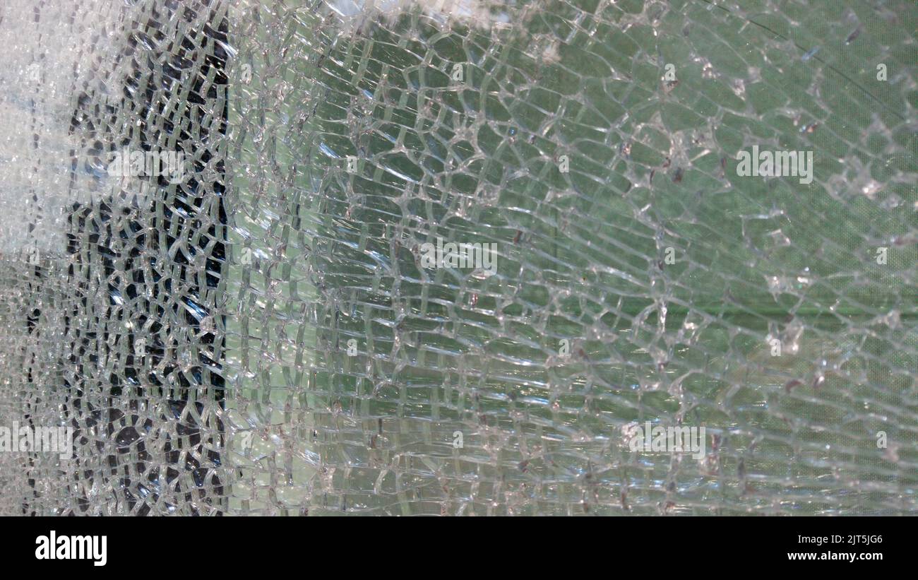 Strained glass broken window from explosion splinter. Shattered glass ...