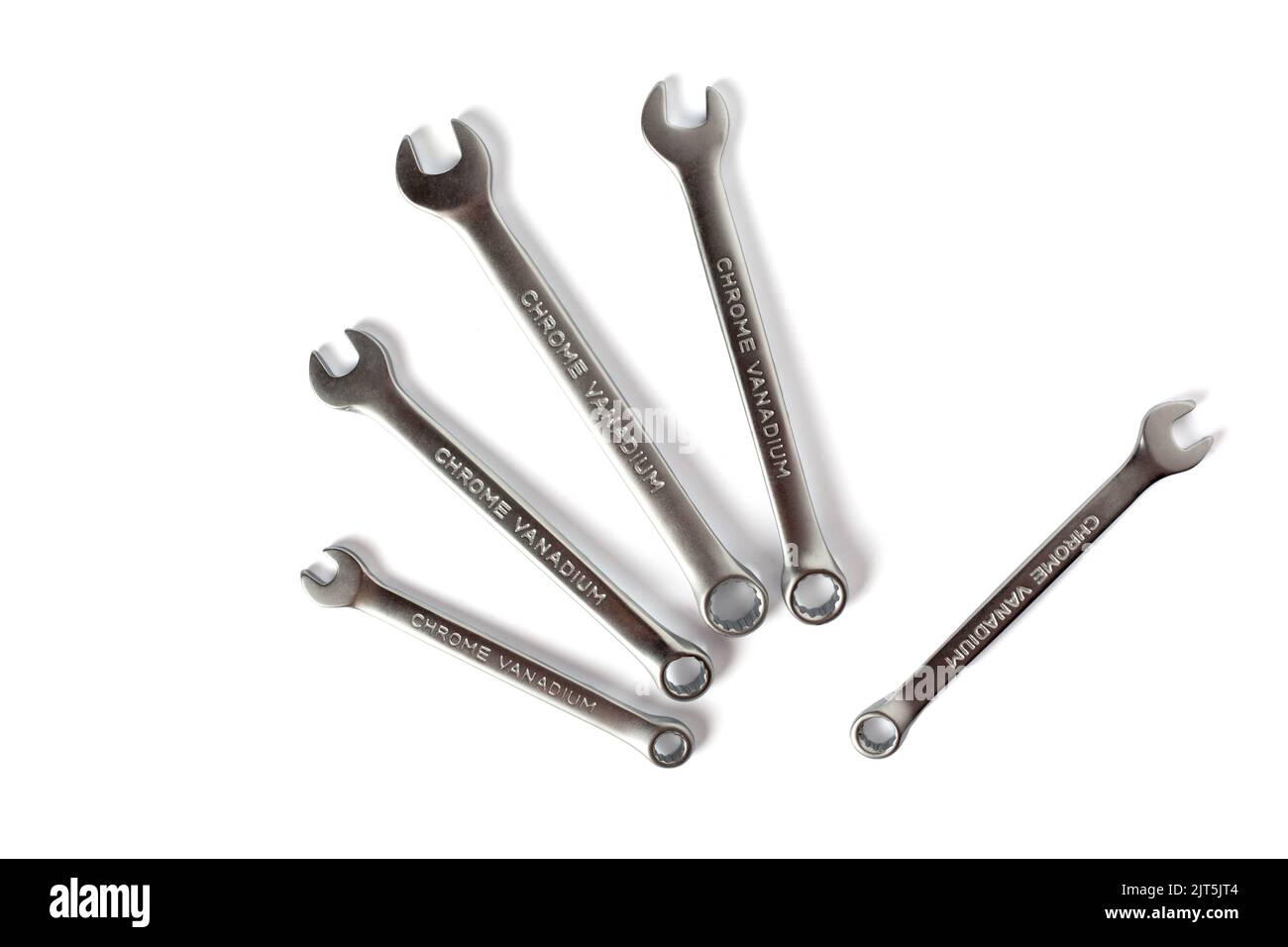 Spanners lies on table in shape of hand isolated on white background ...