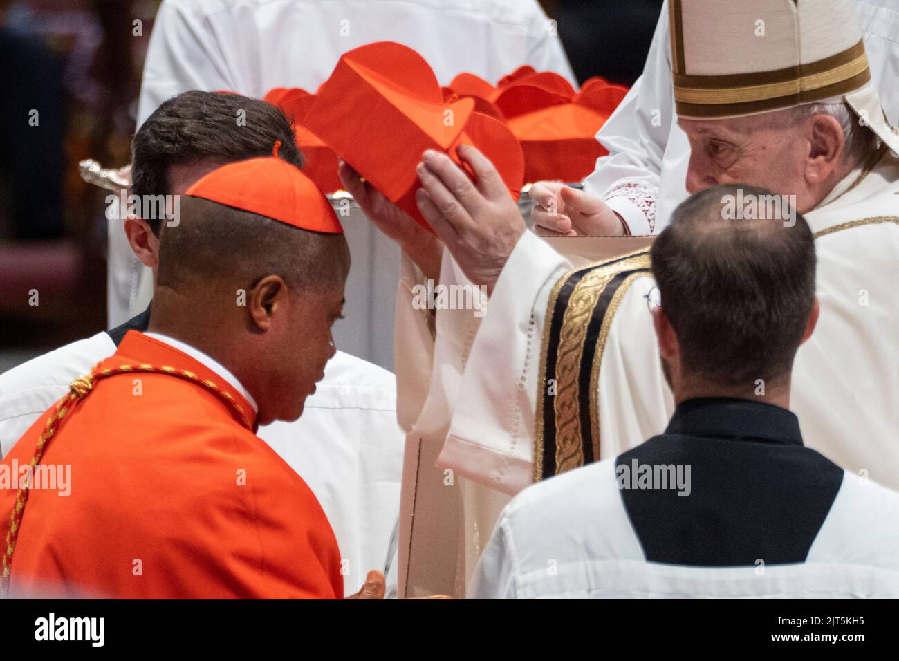 New Cardinal Peter Ebere Okpaleke receives the red three-cornered ...