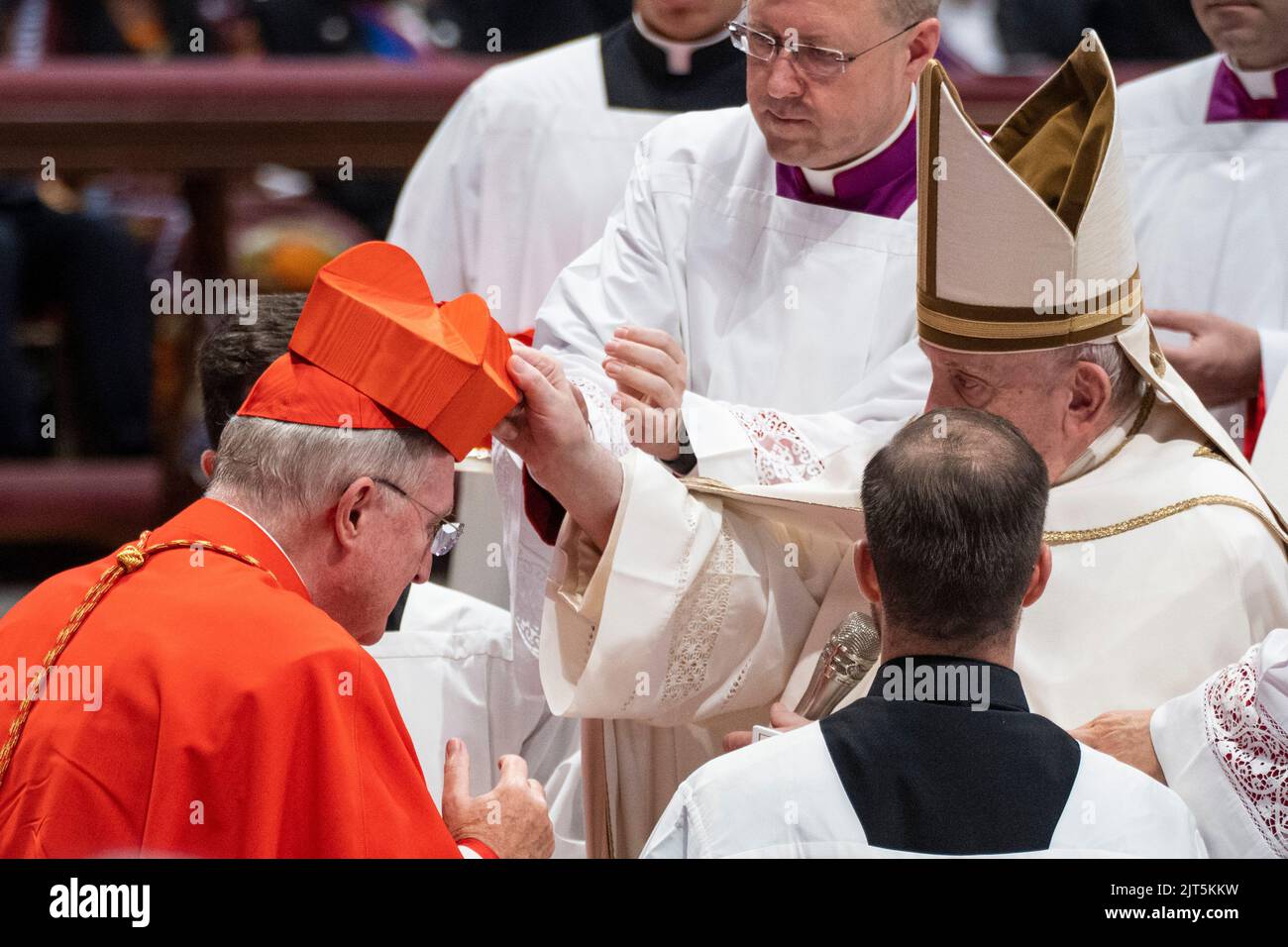 New Cardinal Arthur Roche receives the red three-cornered biretta hat ...