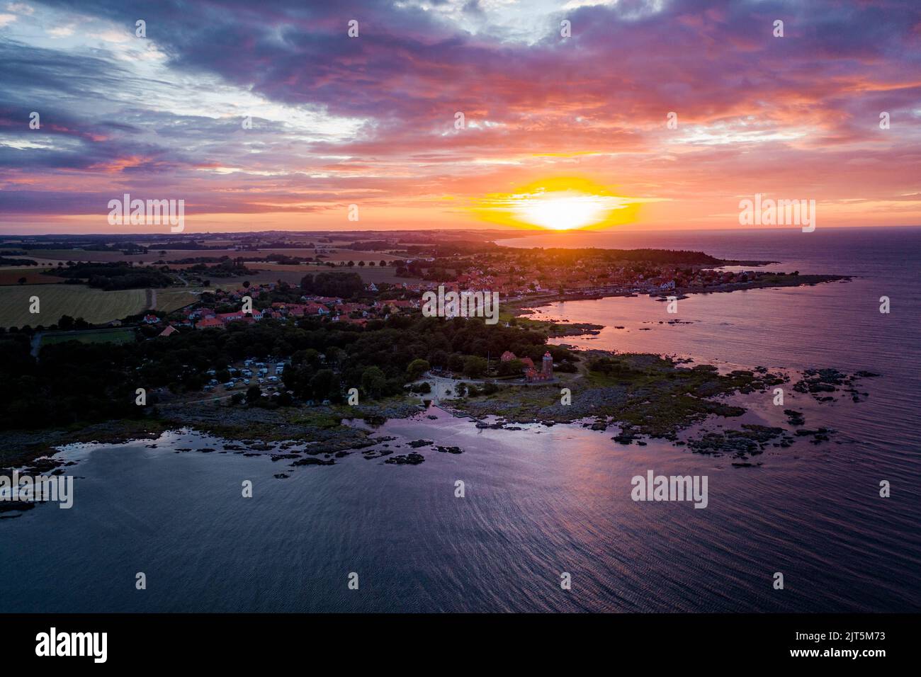 aerial view of svaneke town at sea coast during sunset on bornholm ...