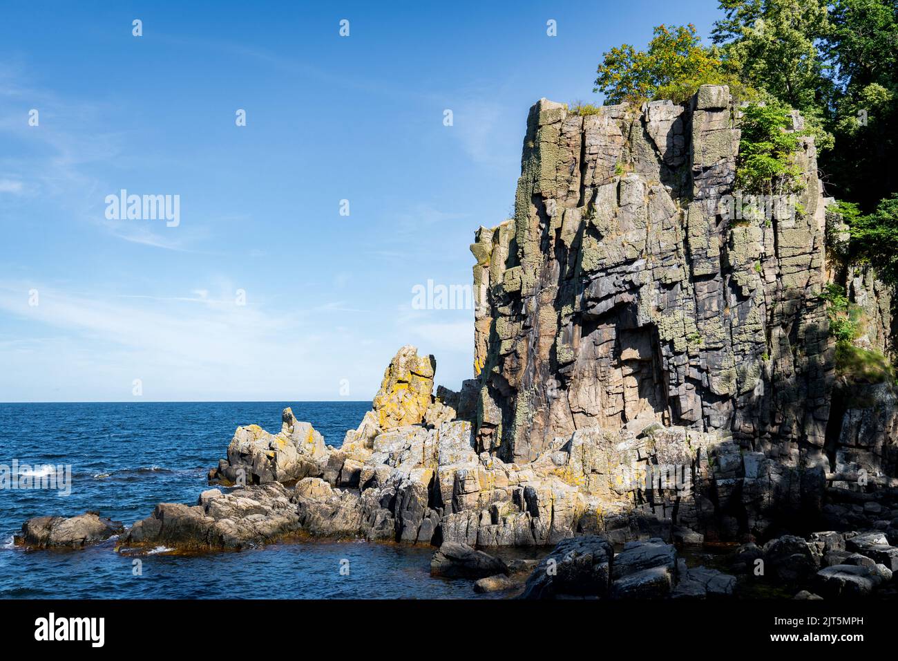 Steep cliffs of the northern coast of Bornholm island ...