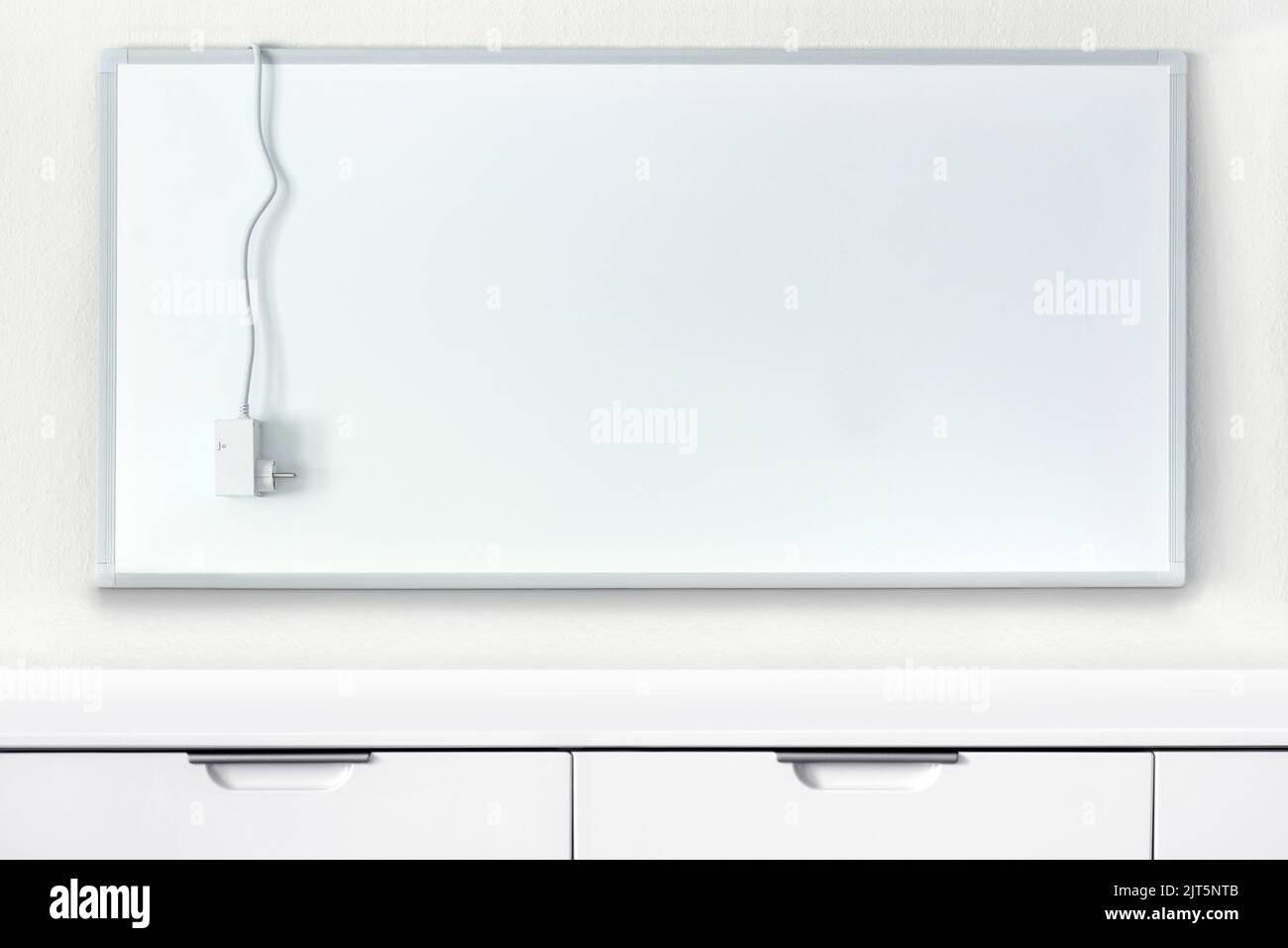 White electric infrared heating panel Stock Photo - Alamy