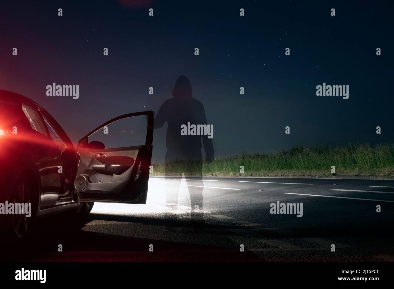 A mysterious transparent, ghost like figure, standing on an spooky ...