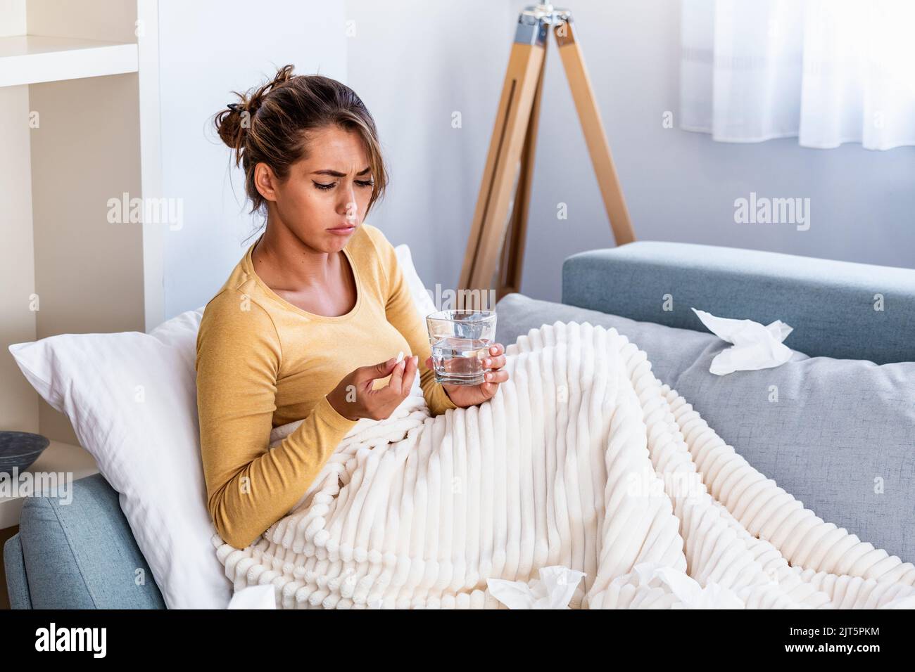Millennial ill sick woman taking painkiller medicine to relieve ...