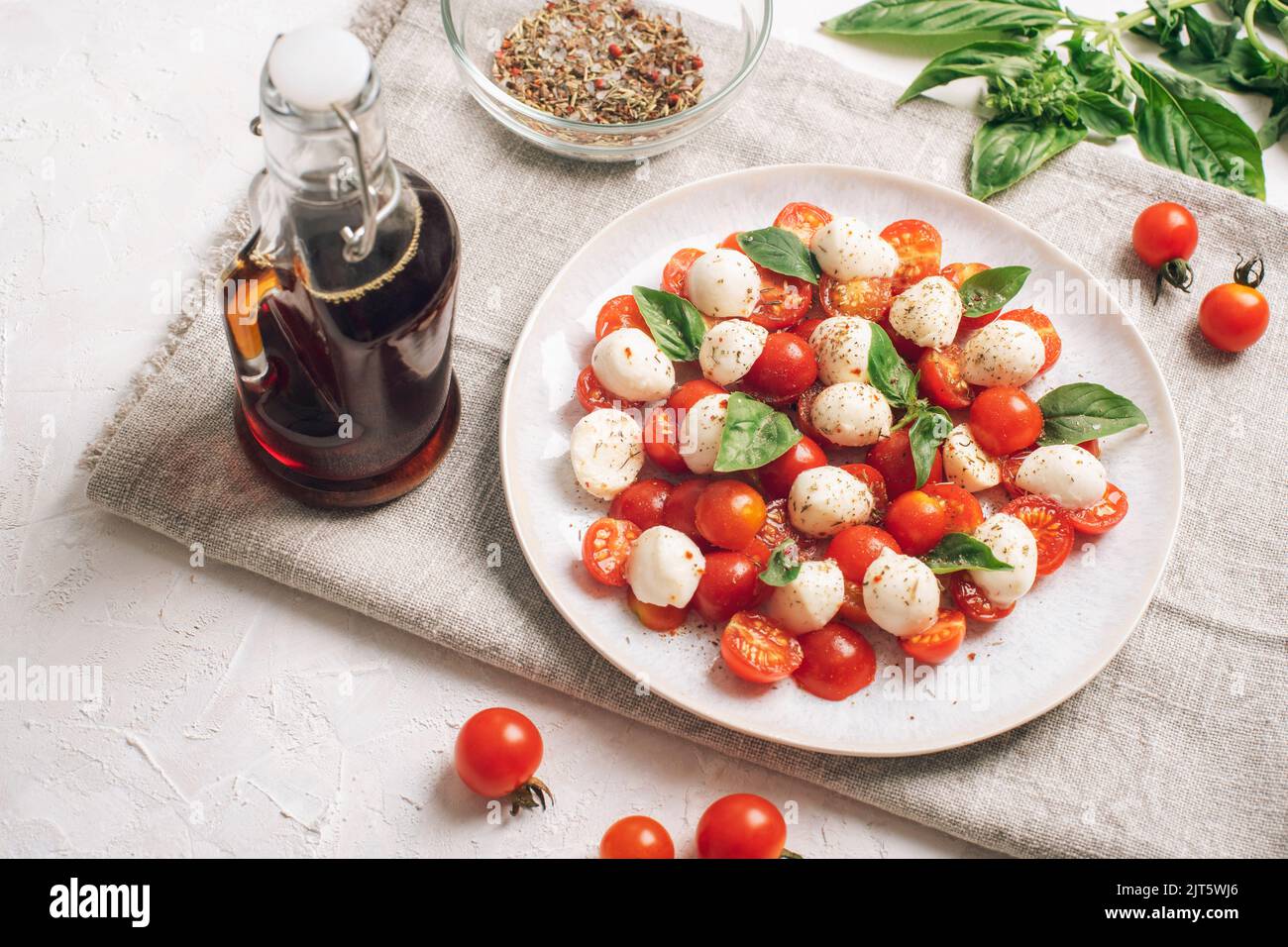 Italian caprese salad with cherry tomatoes, mozzarella, basil, balsamic ...