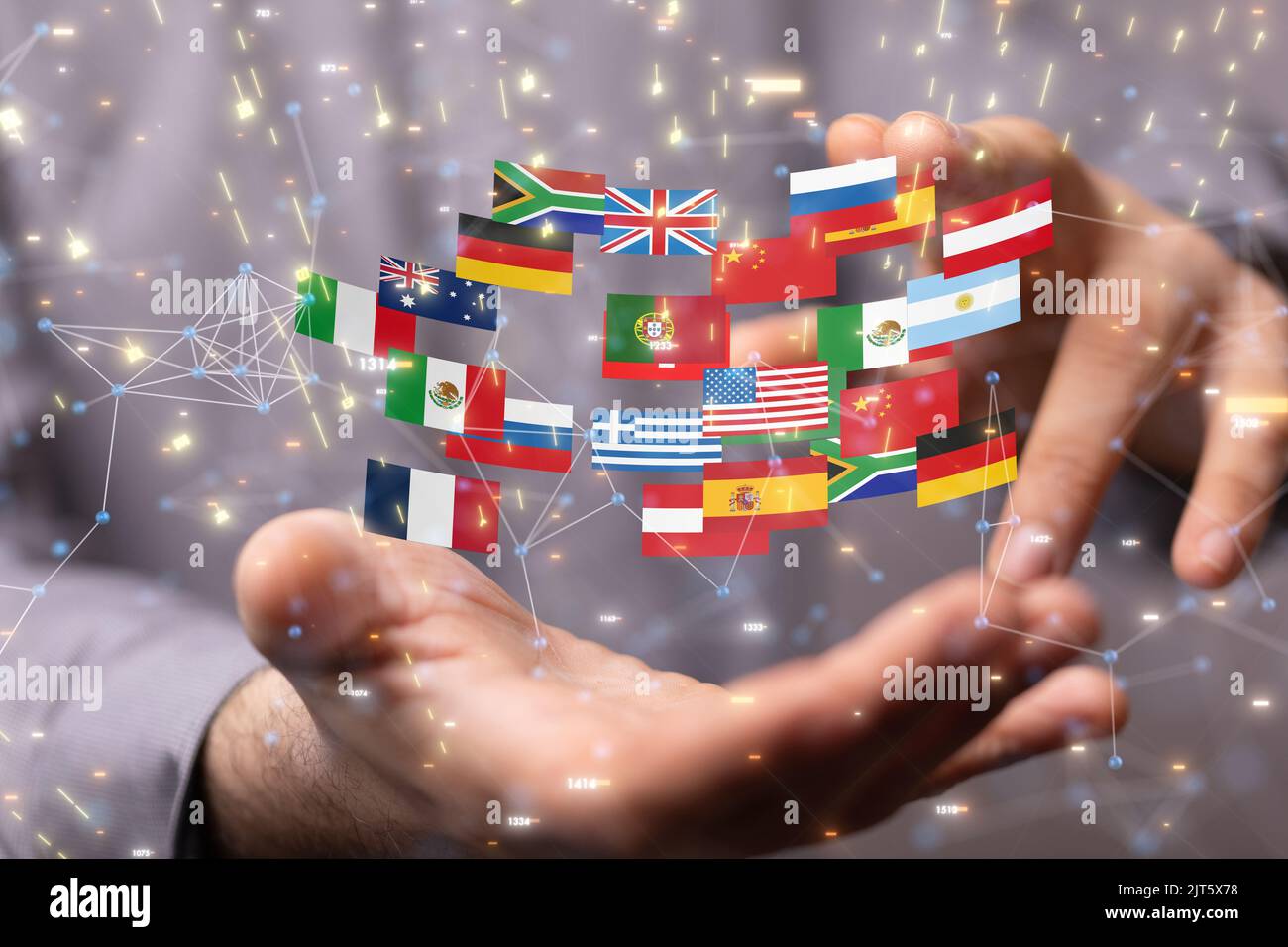 The flags of different countries hovering above the hand Stock Photo ...