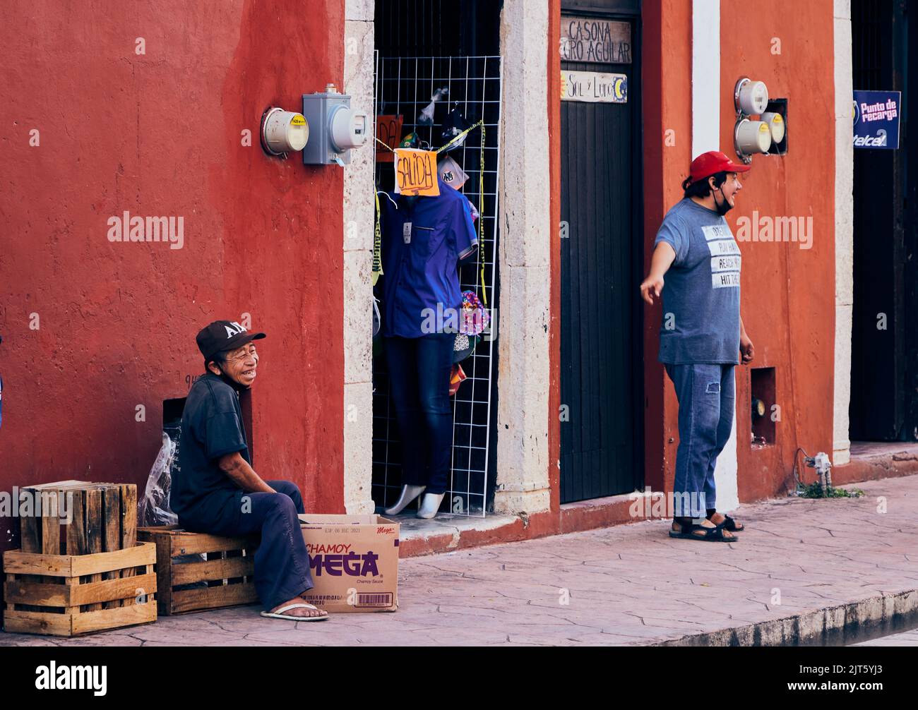 Mexican men laughing on the street in Valladolid, Yucatan, Mexico Stock ...