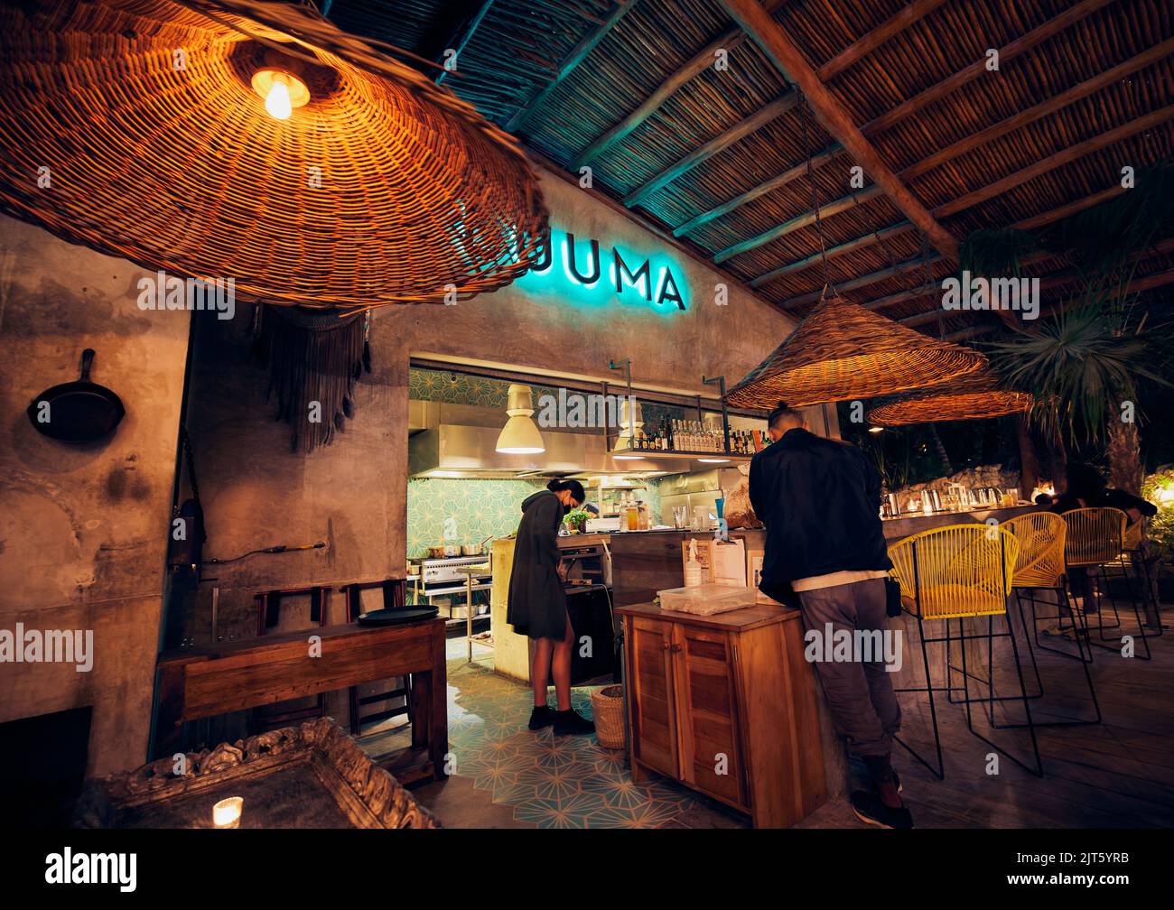 The bar of Luuma with staff in Holbox at night, Mexico Stock Photo - Alamy