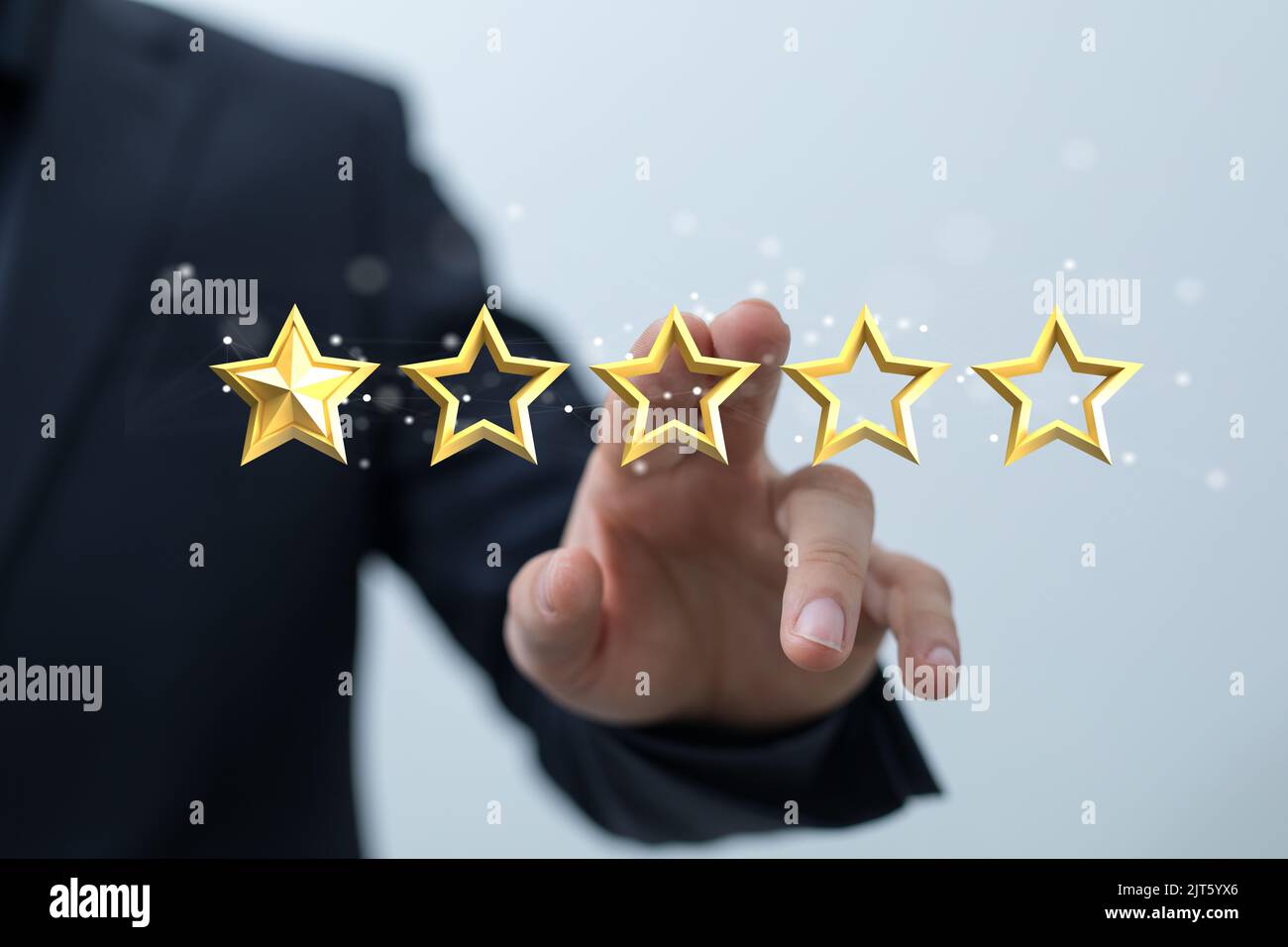 A 3D rendered five-star icon hovering in mans hand Stock Photo - Alamy