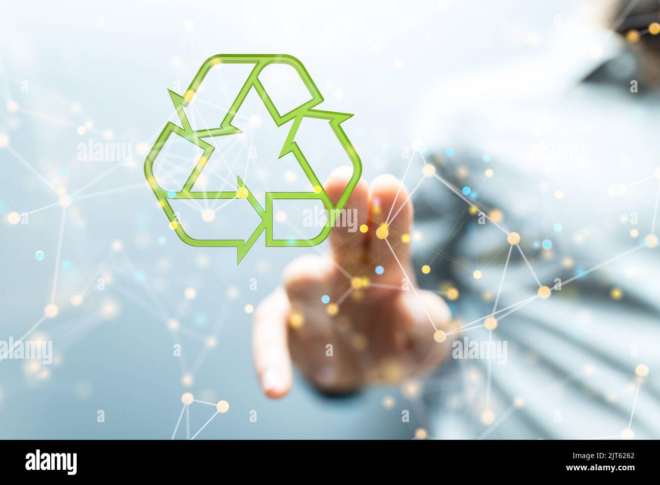 The hand touching a green recycling sign Stock Photo - Alamy