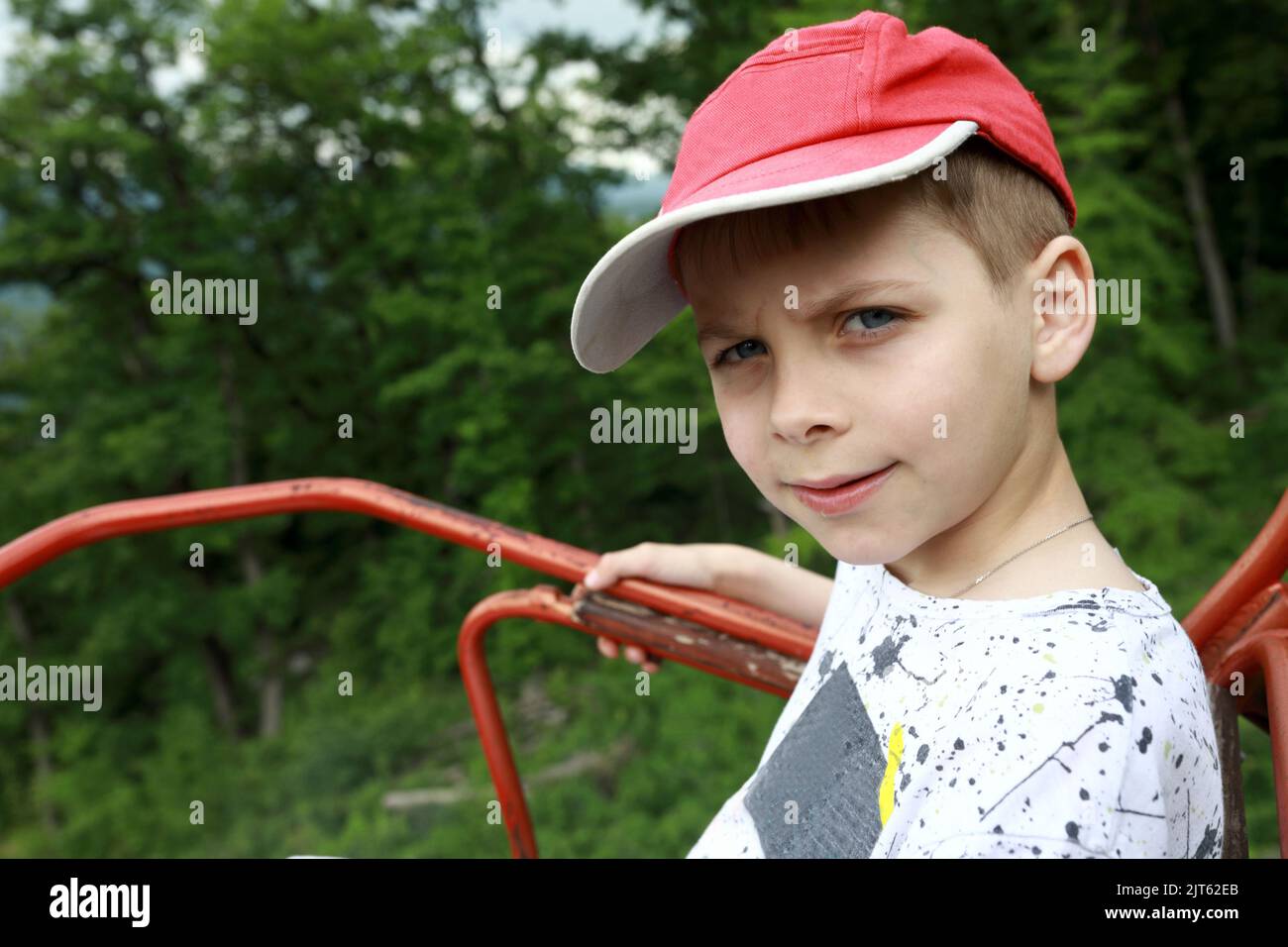 Boy in chair of Savran cable car, Adygea Stock Photo - Alamy