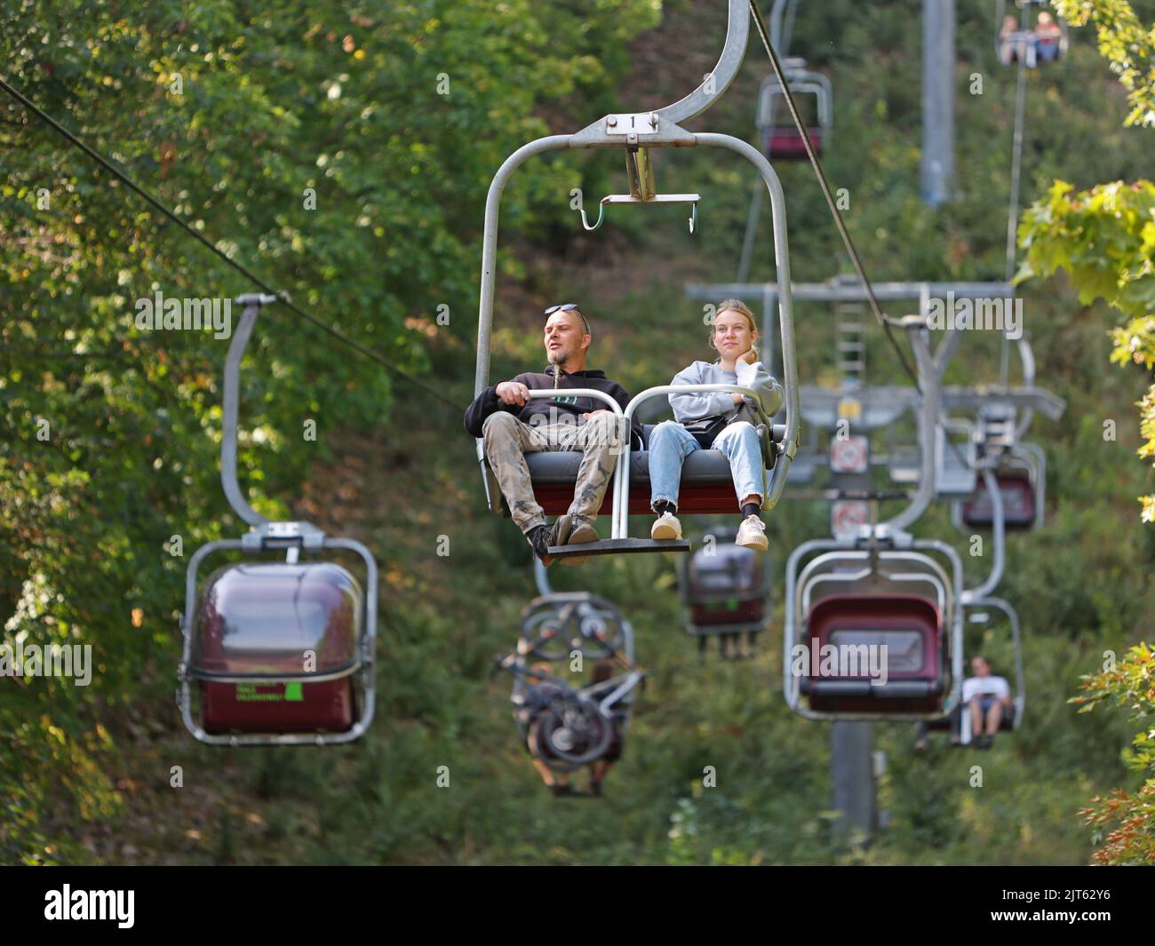 Thale, Germany. 28th Aug, 2022. Visitors take the chairlift to the ...