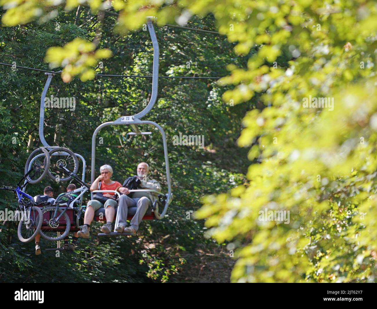 Thale, Germany. 28th Aug, 2022. Visitors take the chairlift to the ...