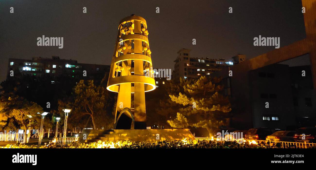 The illuminated badge of Beijing Normal University at night Stock Photo ...