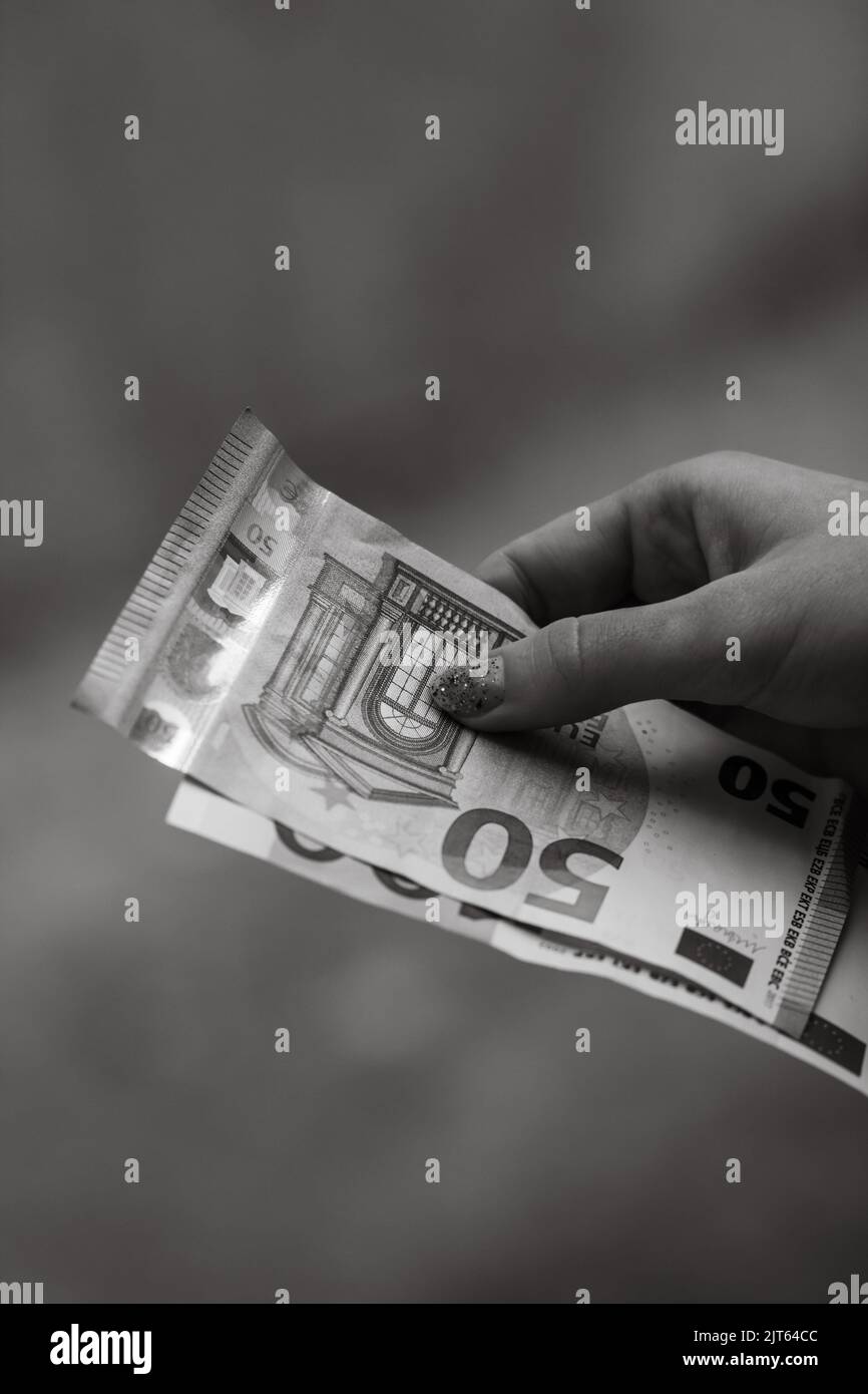 Grayscale closeup hand holding hi-res stock photography and images - Alamy