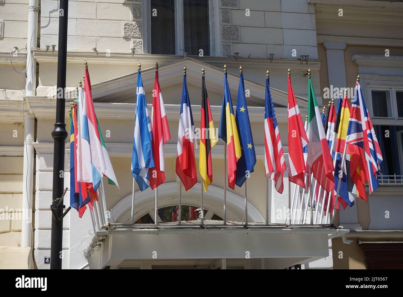 The flags of different countries on a building Stock Photo - Alamy
