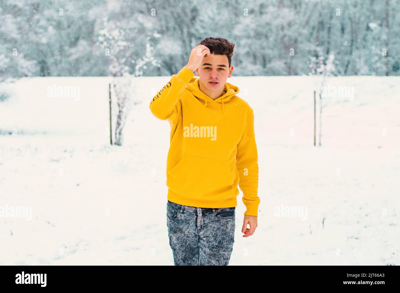 Male model posing in snow hi-res stock photography and images - Alamy