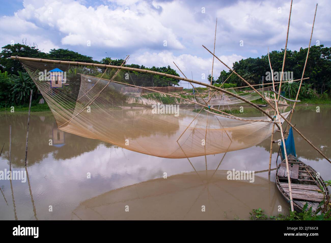 Traditional Fishing net Vessel in the river water by Bangladesh Stock ...