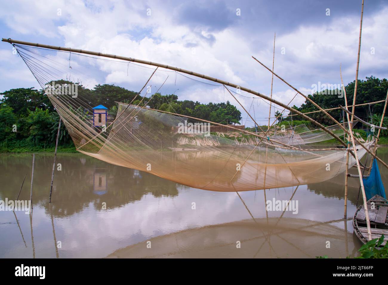Traditional Fishing net Vessel in the river water by Bangladesh Stock ...