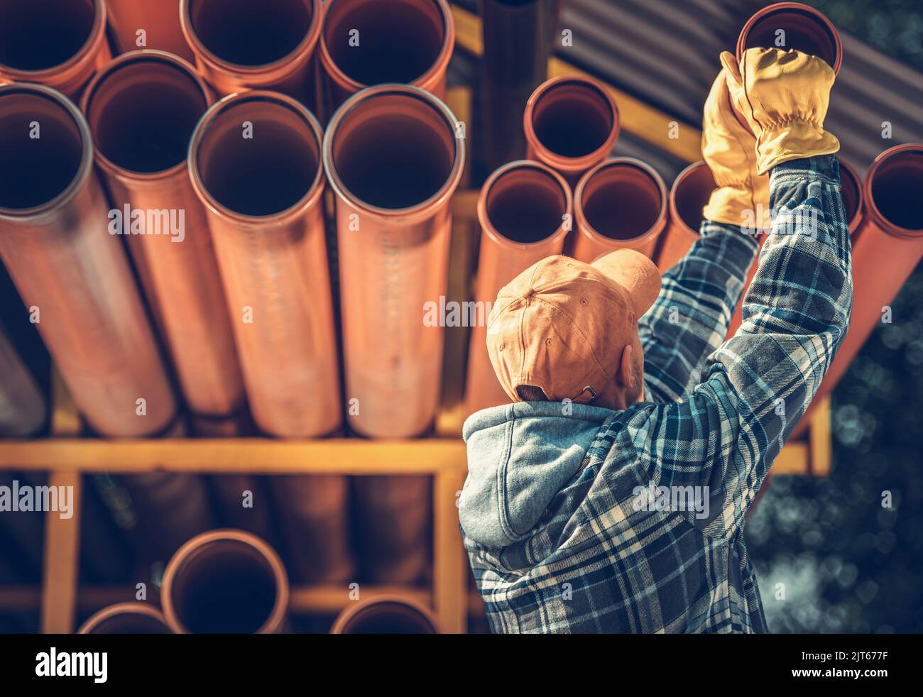Construction Worker Buying Plastic Serwer Line Pipes To Build New ...
