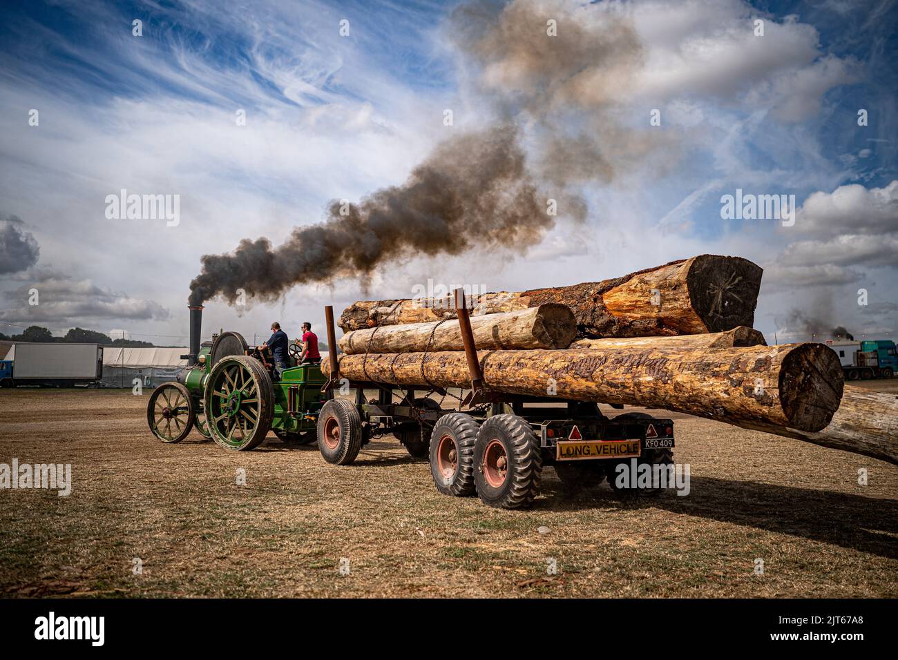 A steam powered traction engine tows huge tree trunks during the Great ...