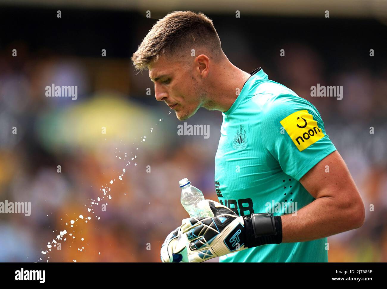 Newcastle United goalkeeper Nick Pope spilts out water during the ...