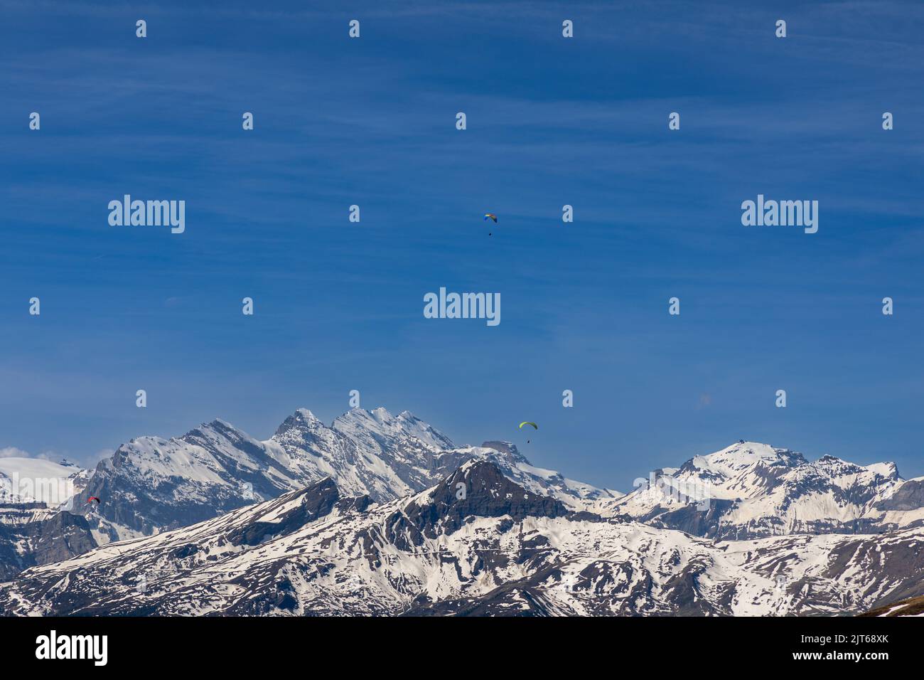 Snow covered mountain peaks of the Swiss alps against the sky ...