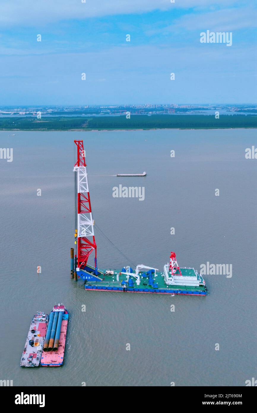 ZHANGJIAGANG, CHINA - AUGUST 28, 2022 - A pile driving ship lowers the ...