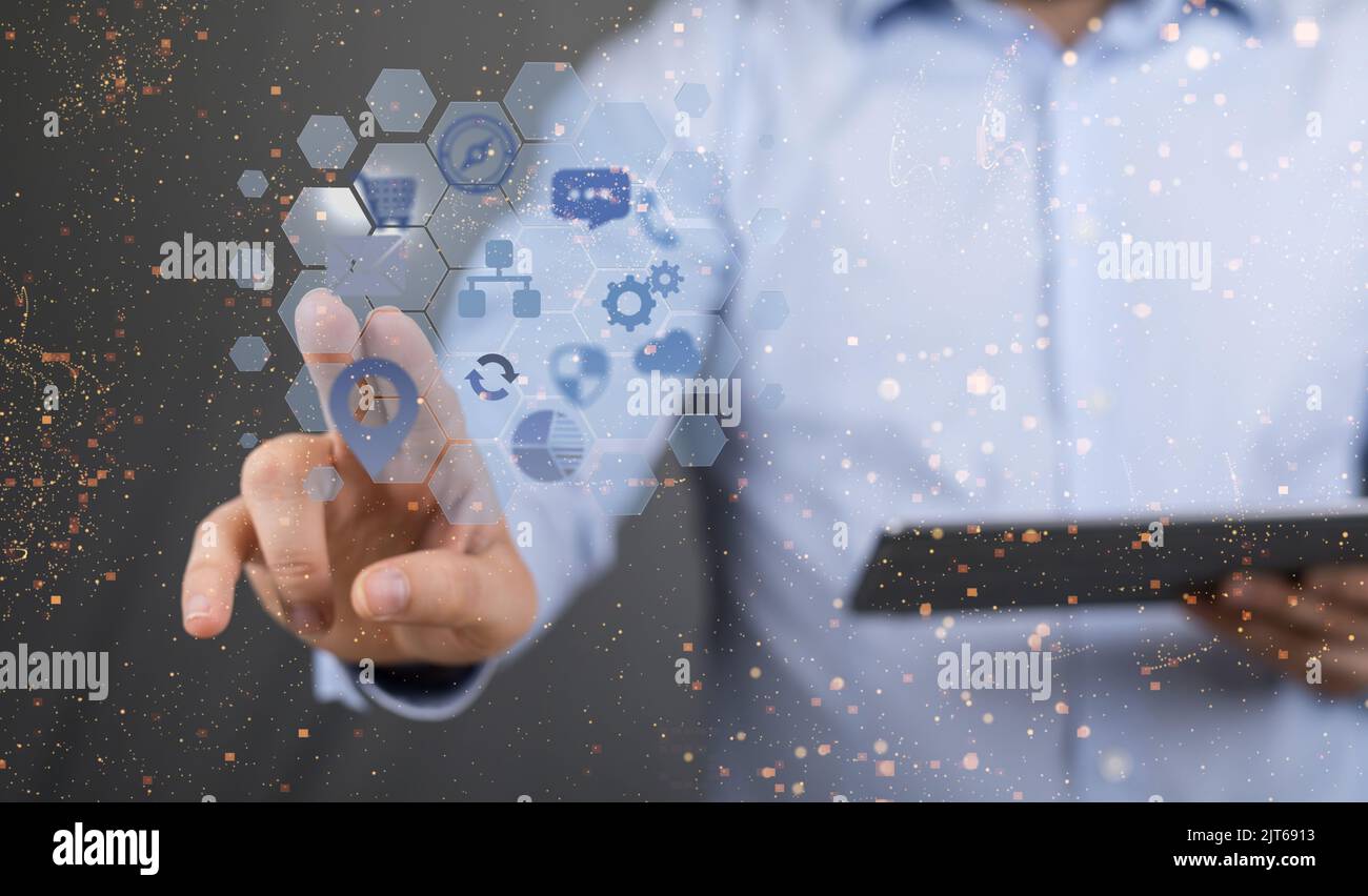 A finger touching a 3D illustration of floating data network symbols ...