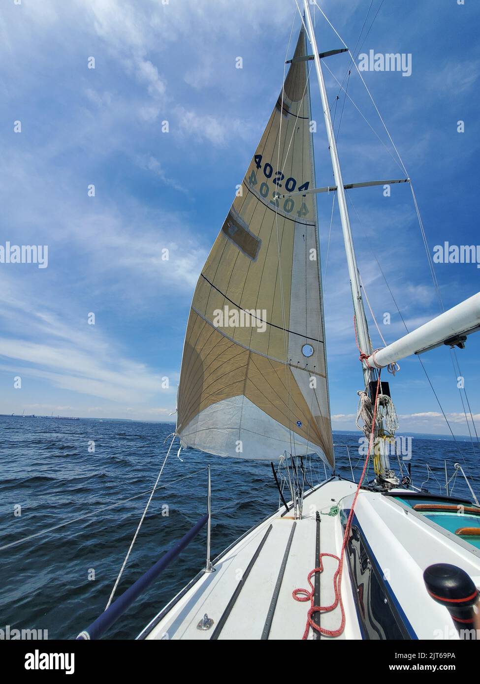 A vertical shot of the view of a sea from a floating sailboat Stock ...