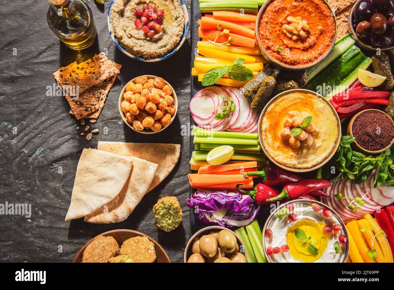 Arabic Cuisine; Middle Eastern meze platter with green falafel, pita ...