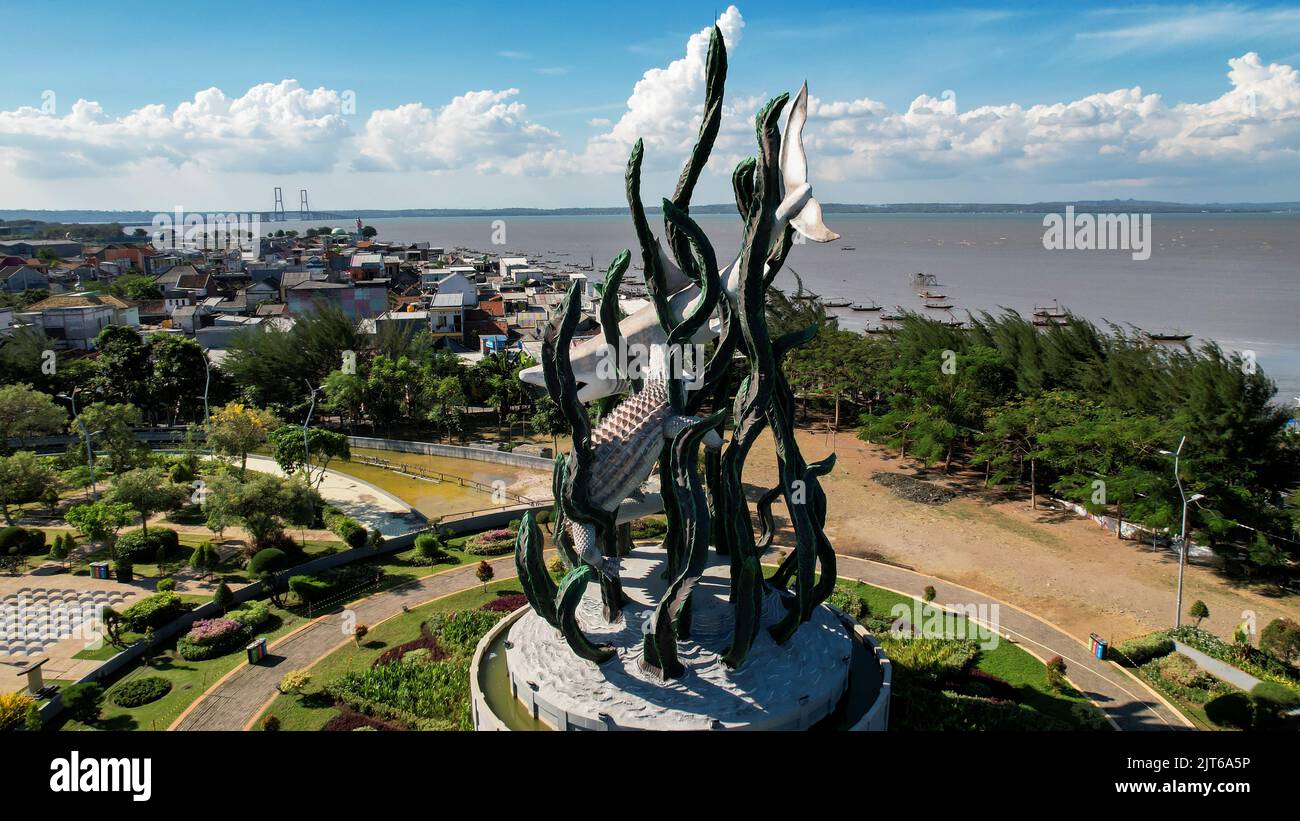 Aerial view of the A giant shark and crocodile statue as a symbol of ...