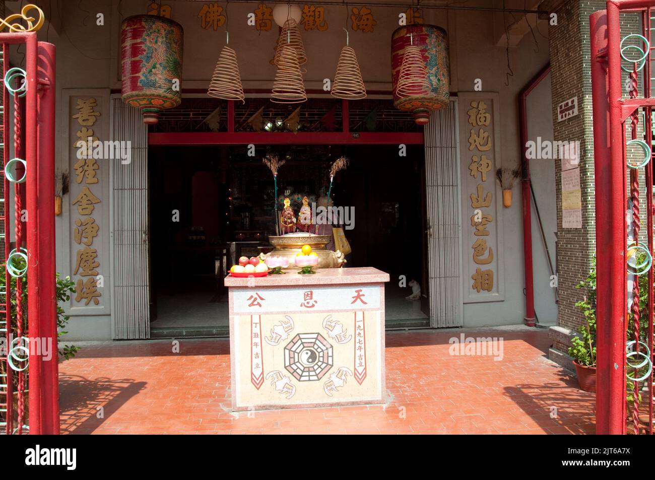 Buddhist Temple, Little India, Singapore. Entrance, incense burning ...