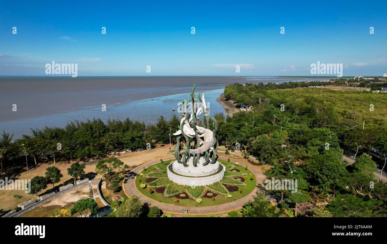 Aerial view of the A giant shark and crocodile statue as a symbol of ...