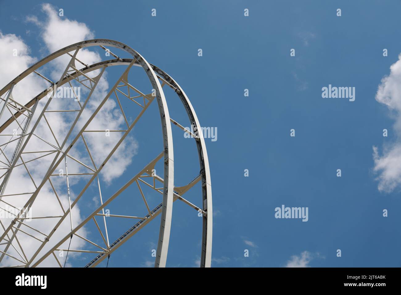 A big circle ride in an amusement park in cloudy sky background Stock ...