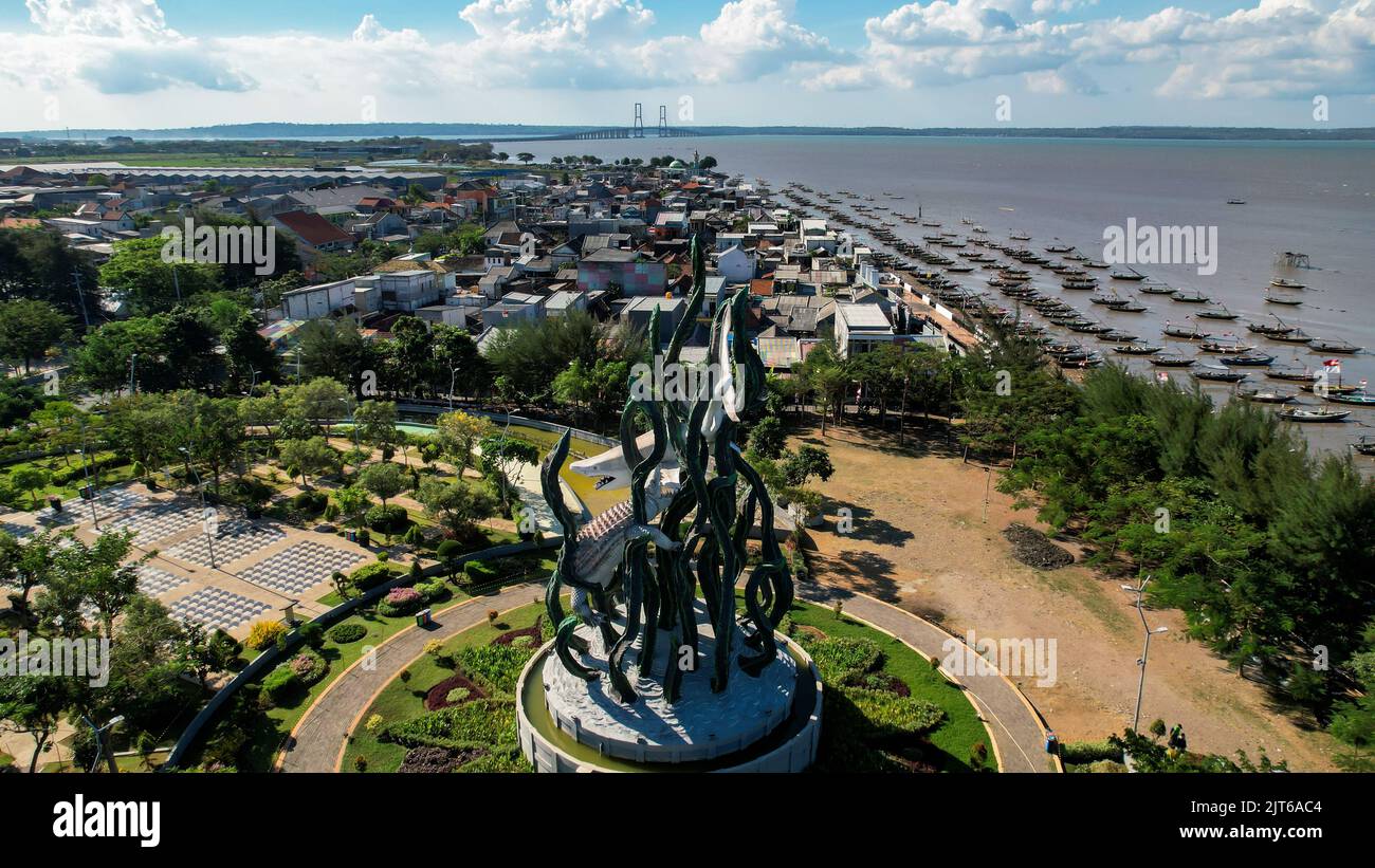 Aerial view of the A giant shark and crocodile statue as a symbol of ...