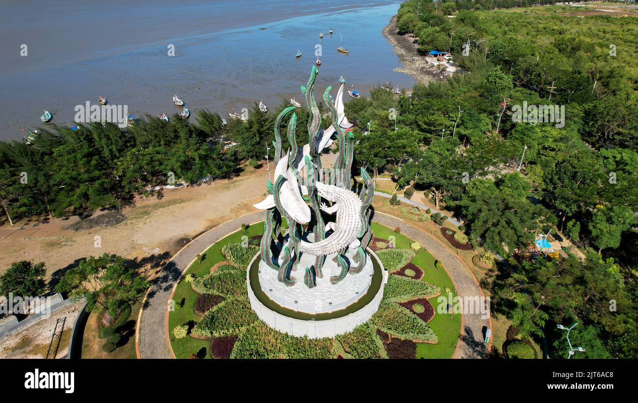 Aerial view of the A giant shark and crocodile statue as a symbol of ...