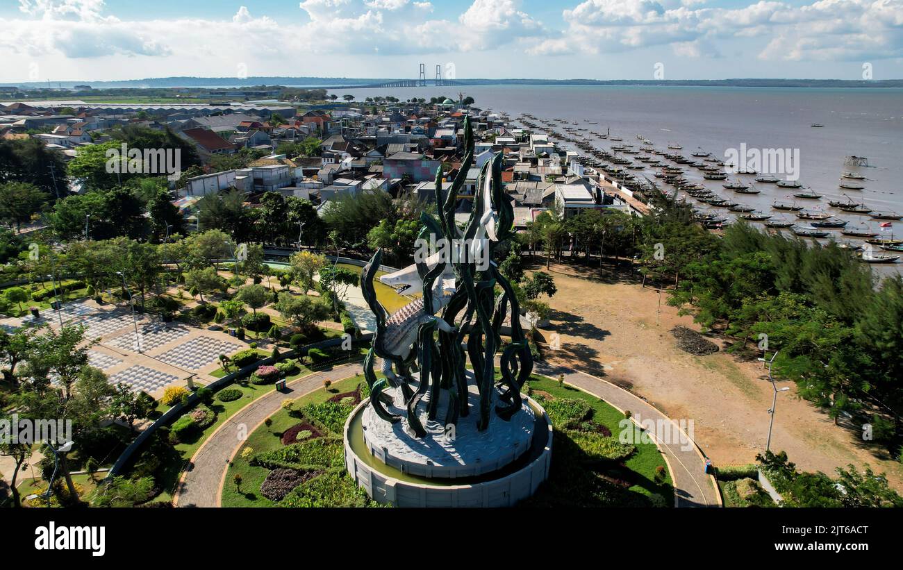 Aerial view of the A giant shark and crocodile statue as a symbol of ...