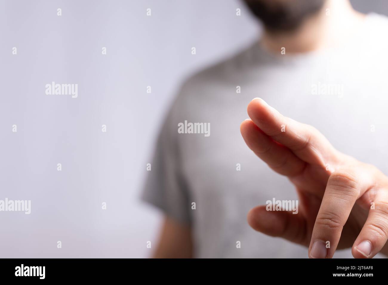 A man pointing at the camera isolated on a grey background Stock Photo ...