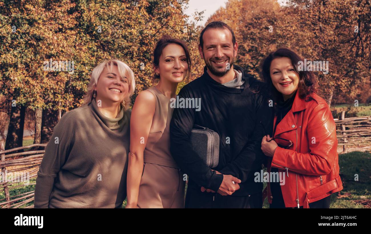 Group of happy people spending their weekend in nature. Portrait of ...