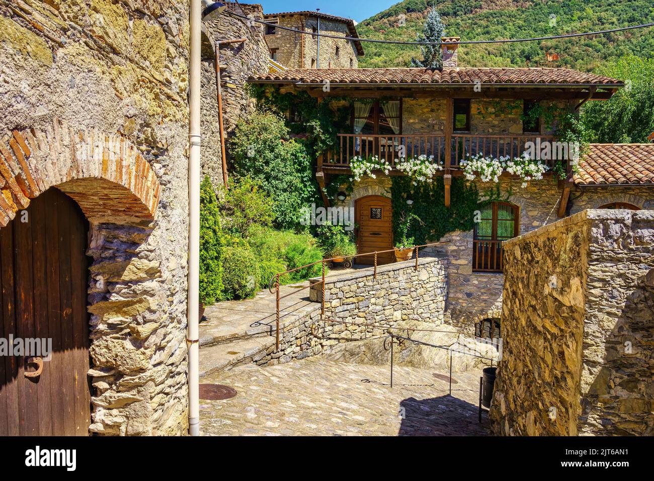 Houses made of stone and wooden balconies in the mountain village of ...