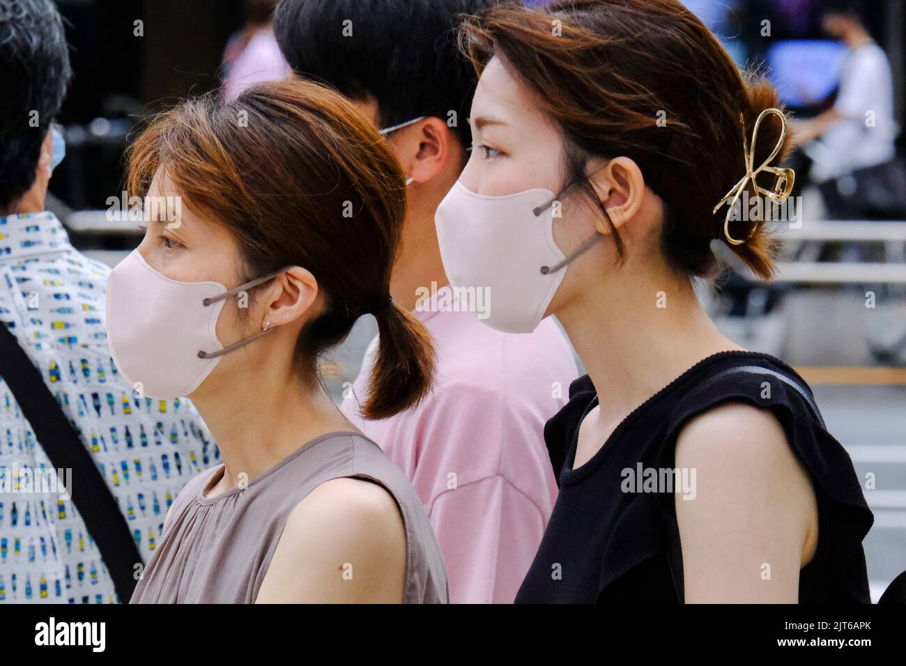 August 24, 2022, Tokyo, Japan: Pedestrians wearing face masks as a ...