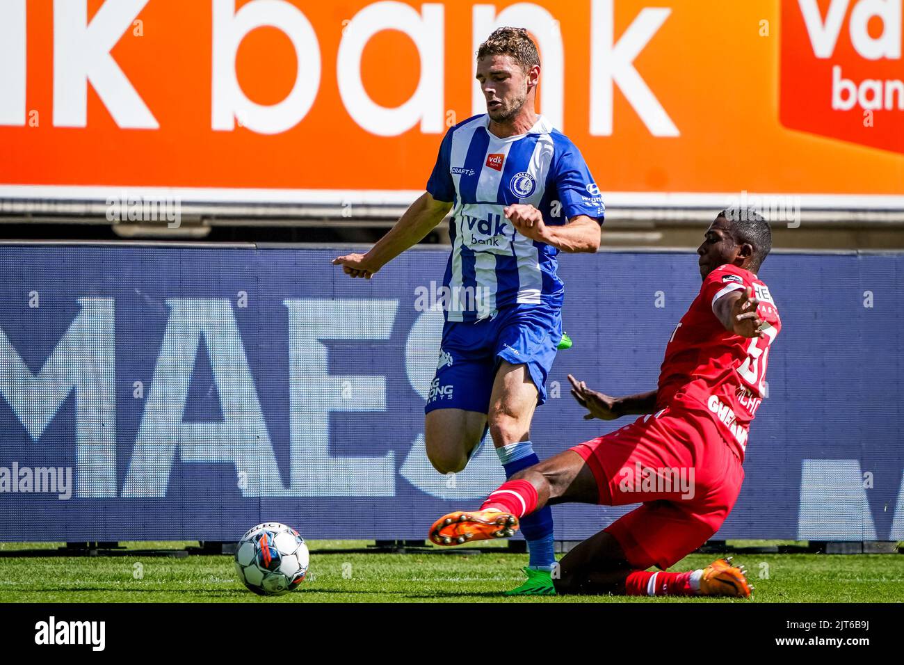 GENT, BELGIUM - AUGUST 28: Hugo Cuypers of KAA Gent is challenged by ...
