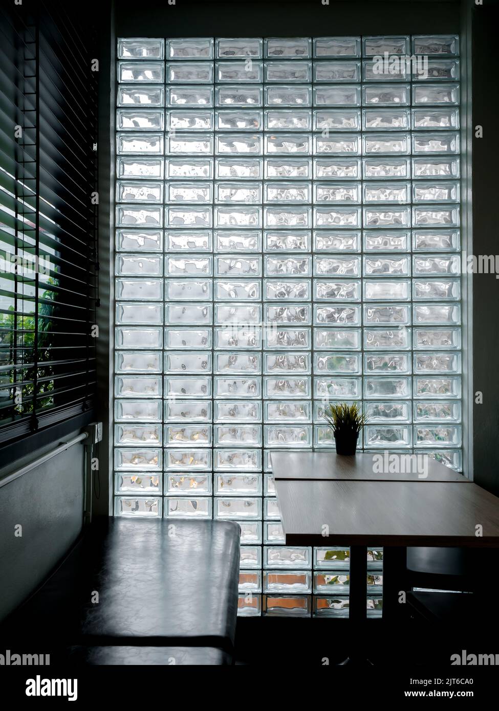 Glass brick wall background. Modern glass block wall with the light ...