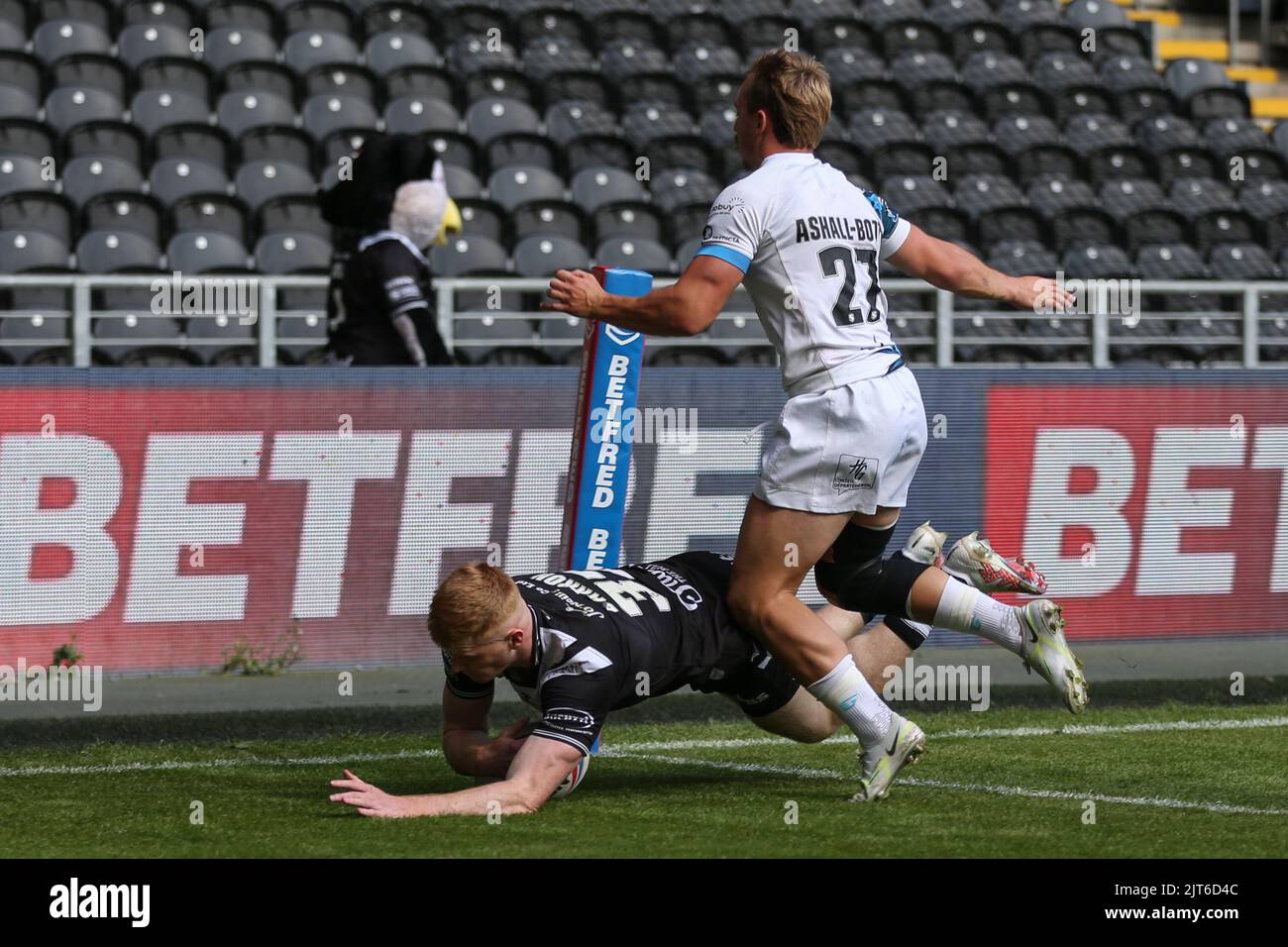 Harvey Barron #32 of Hull FC goes over for a first try of the match to ...